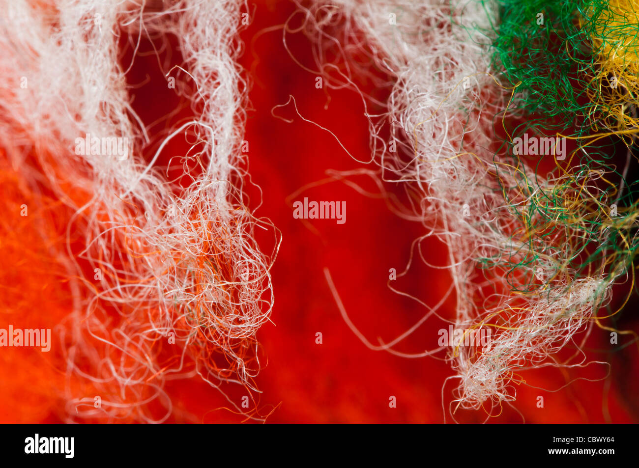 White and red wool fibers closeup Stock Photo - Alamy