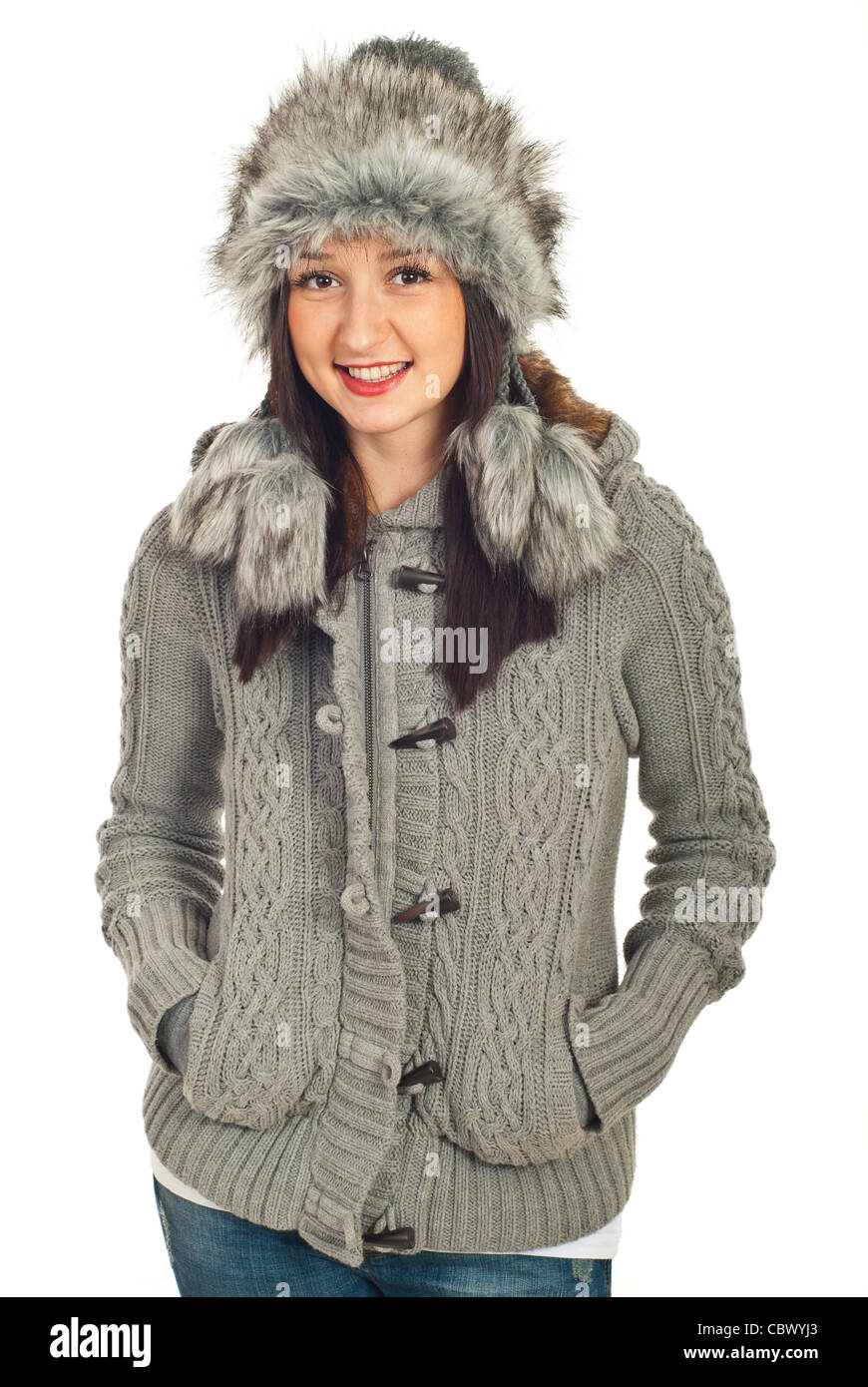 Beauty smiling model woman in fur ha and knit jacket isolated on white ...