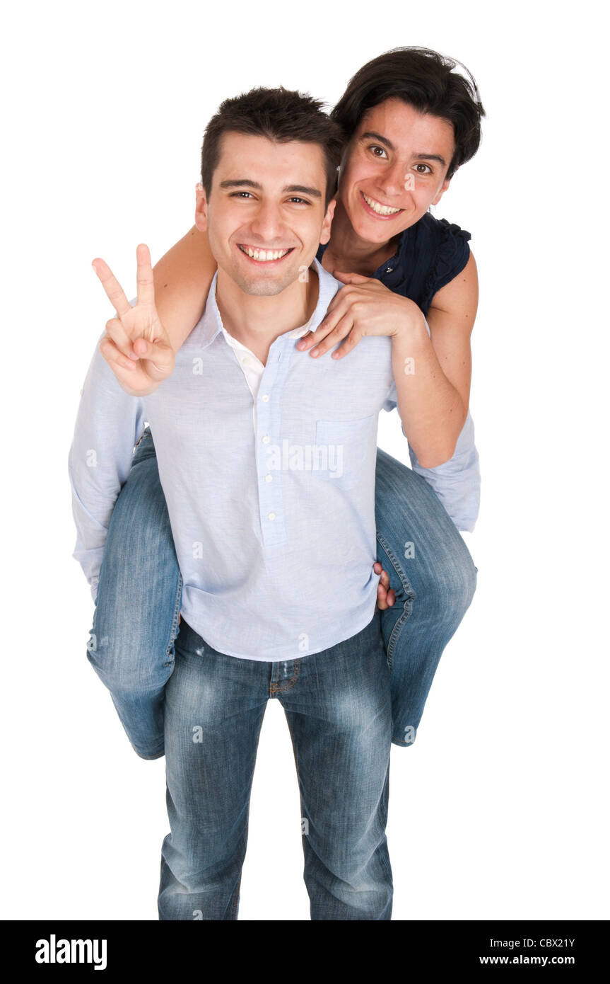 Brother and sister showing victory hand playing piggyback Stock Photo ...