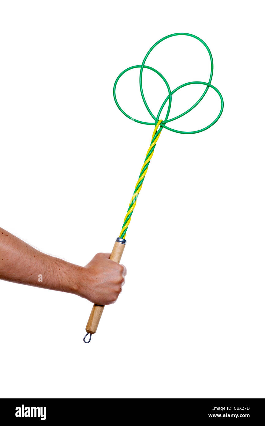 the carpet beater in hand ready to use. Isolated on white background ...