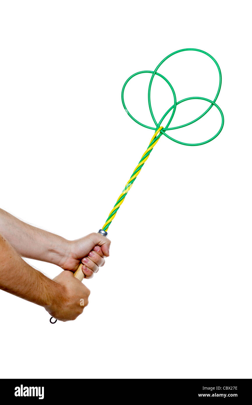 the carpet beater in two hands ready to use. Isolated on white ...