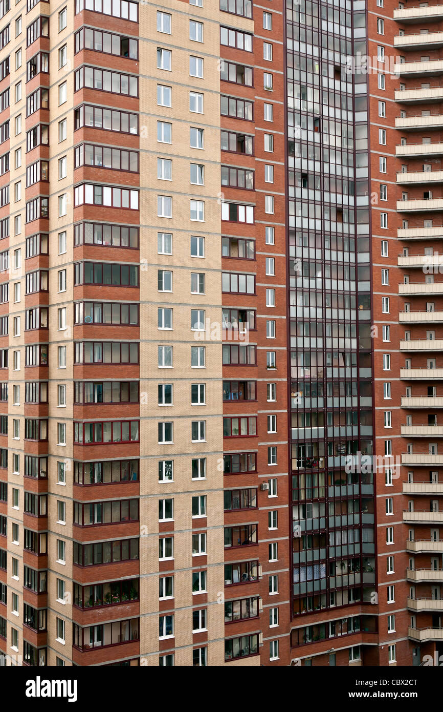 multi-storey brick house with windows and balconies Stock Photo - Alamy