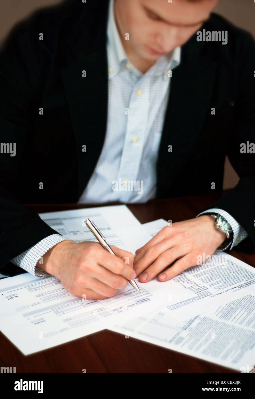 Filling out paperwork hi-res stock photography and images - Alamy