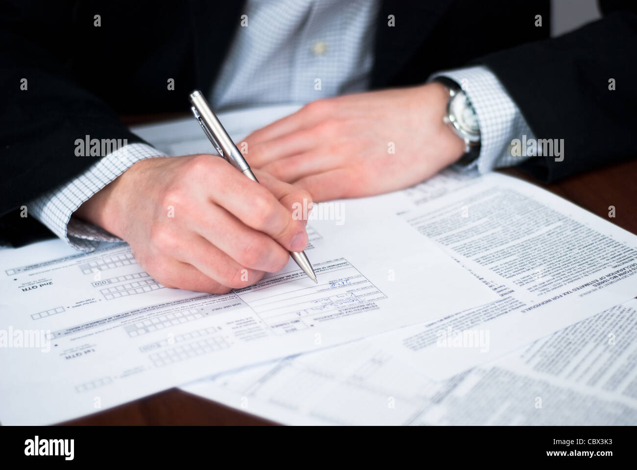 Businessman filling out form desk hi-res stock photography and images ...