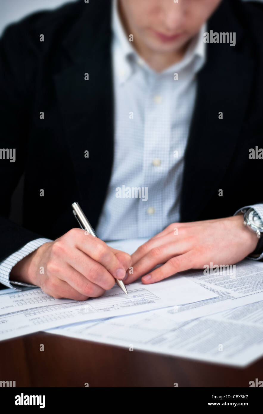 Filling out paperwork hi-res stock photography and images - Alamy