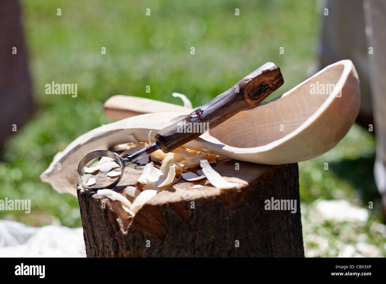 Hand carved wooden spoon with carving tools Stock Photo - Alamy