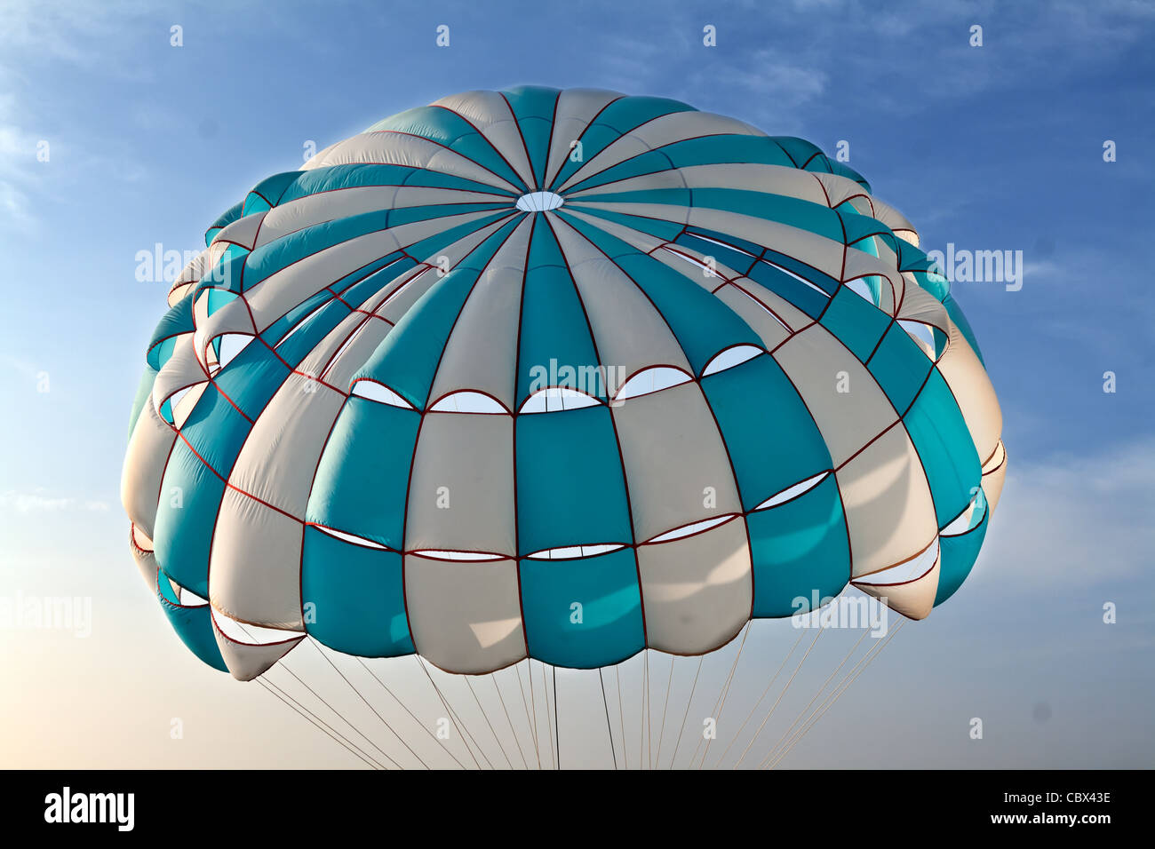 Colorful parachute gliding in sky hi-res stock photography and images ...