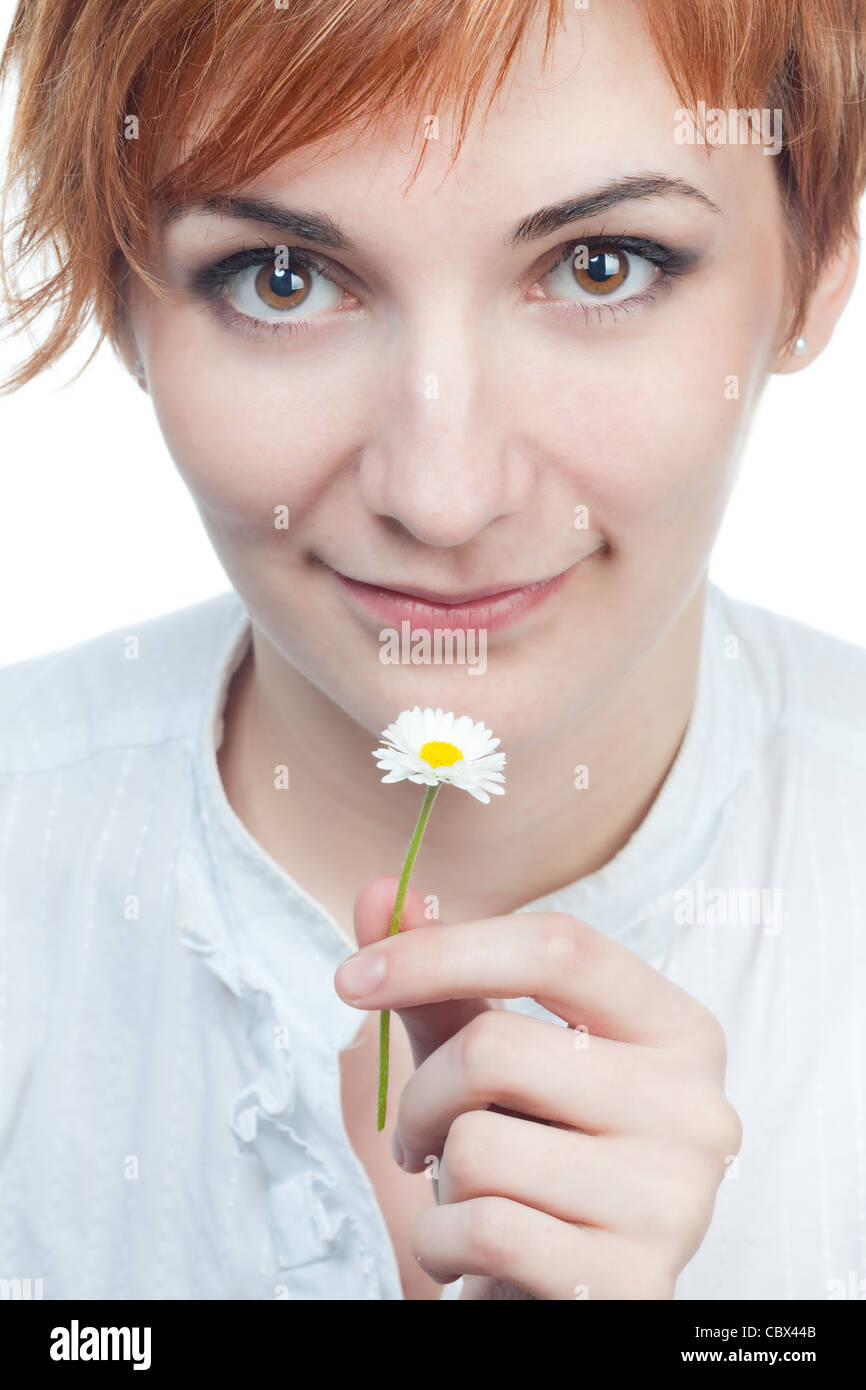 Young woman smelling daisy Stock Photo - Alamy