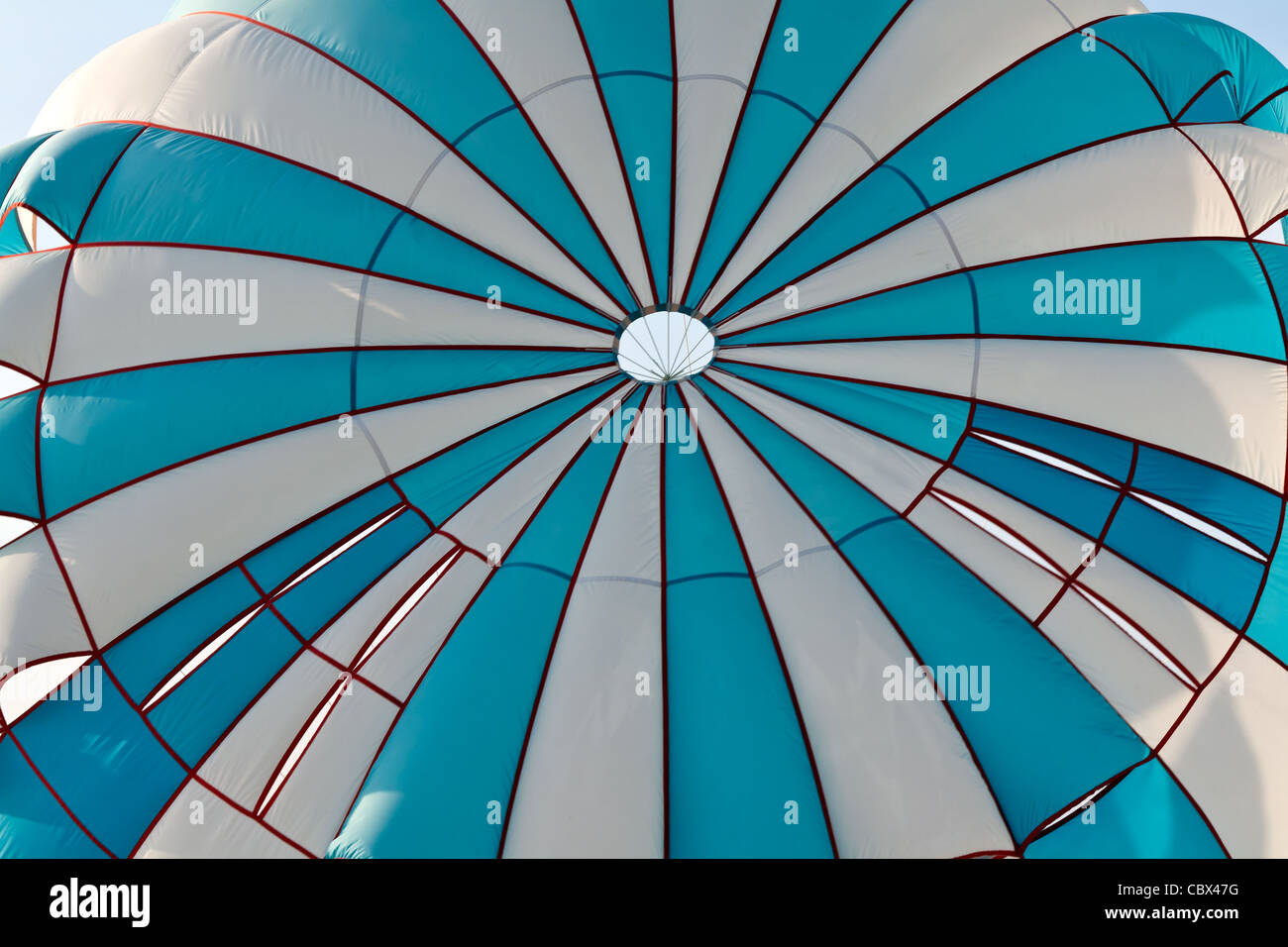 striped blue with a white parachute in the wind Stock Photo - Alamy