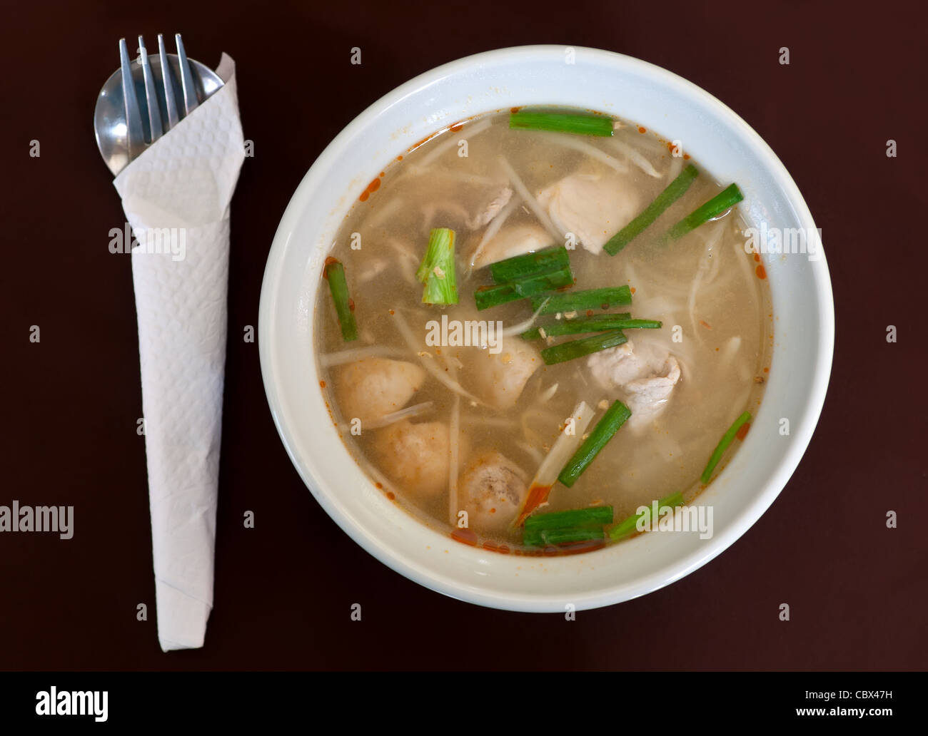 Thai soup dish with meat in brown cloth Stock Photo - Alamy