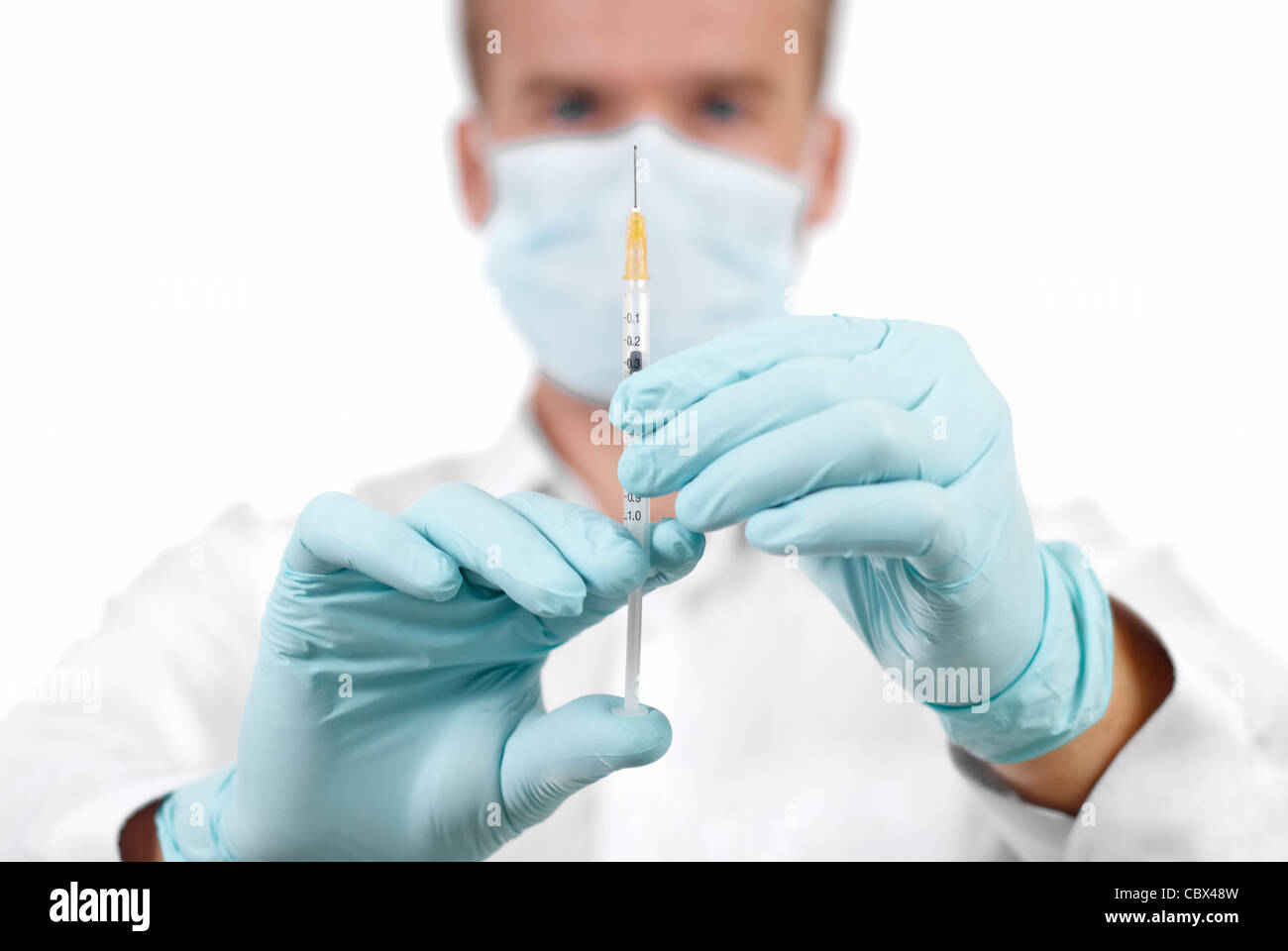 Medical doctor with syringe in hands Stock Photo - Alamy
