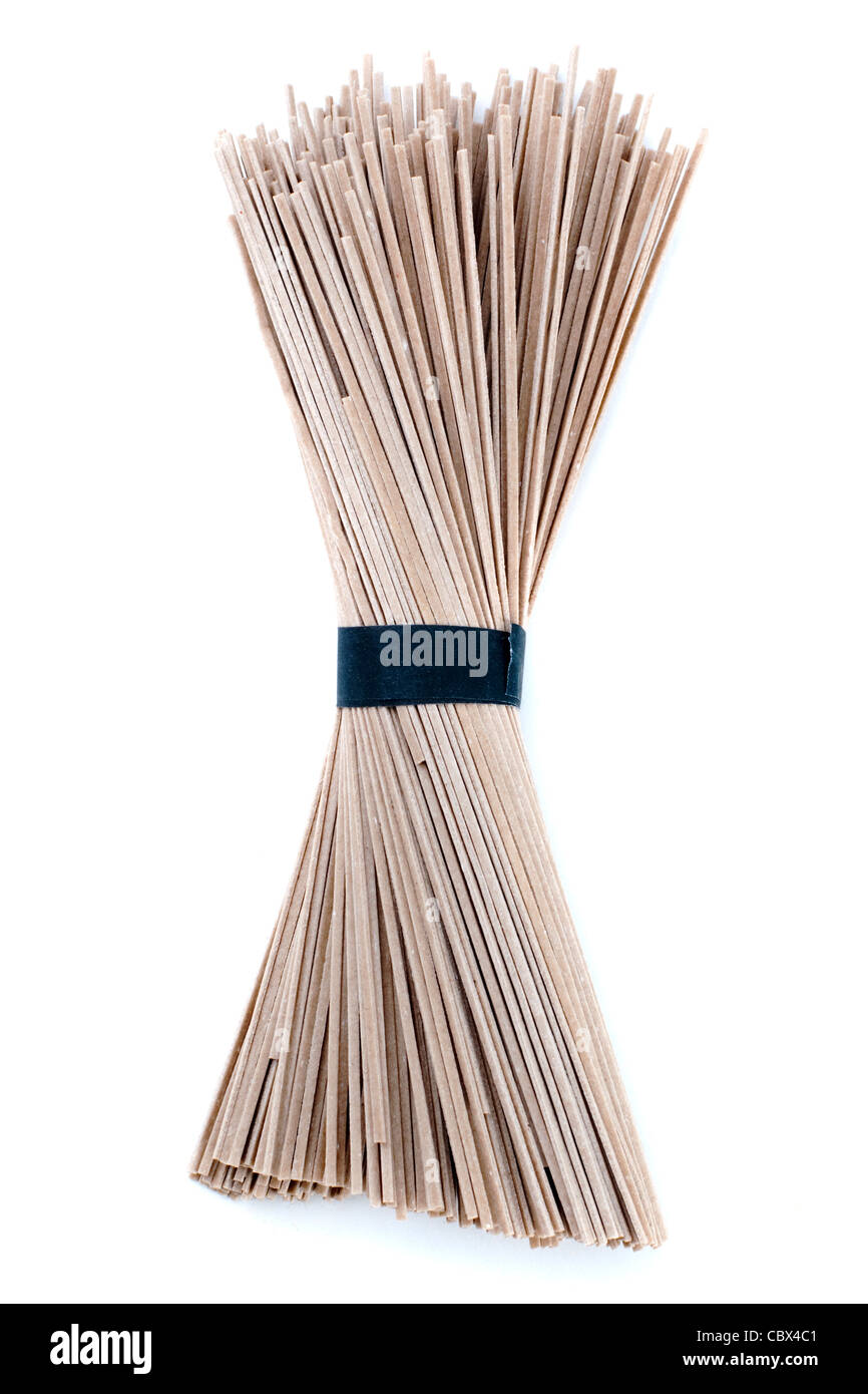 Bundle of buckwheat soba noodles. Isolated on white Stock Photo - Alamy