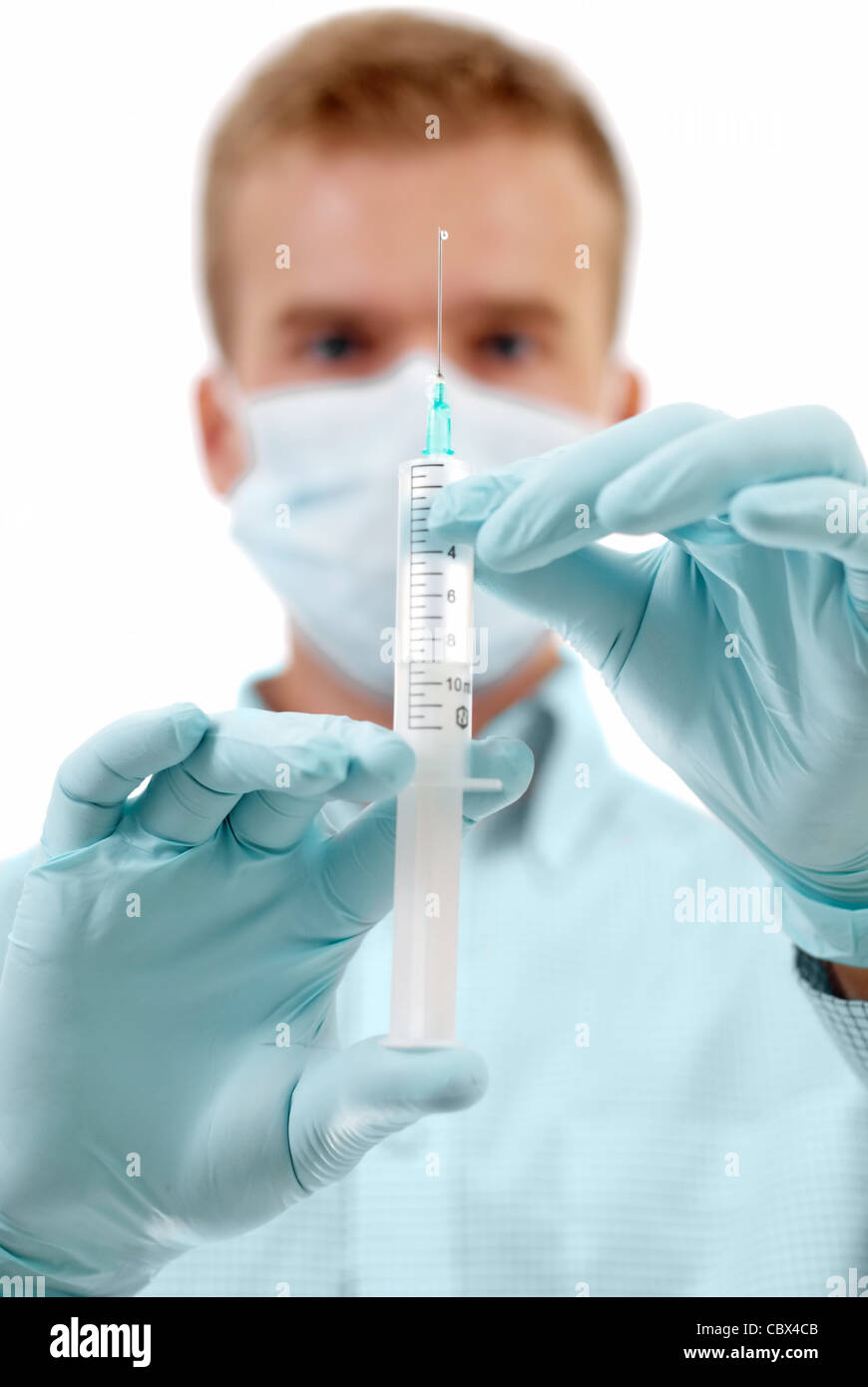 Medical doctor with syringe in hands Stock Photo - Alamy