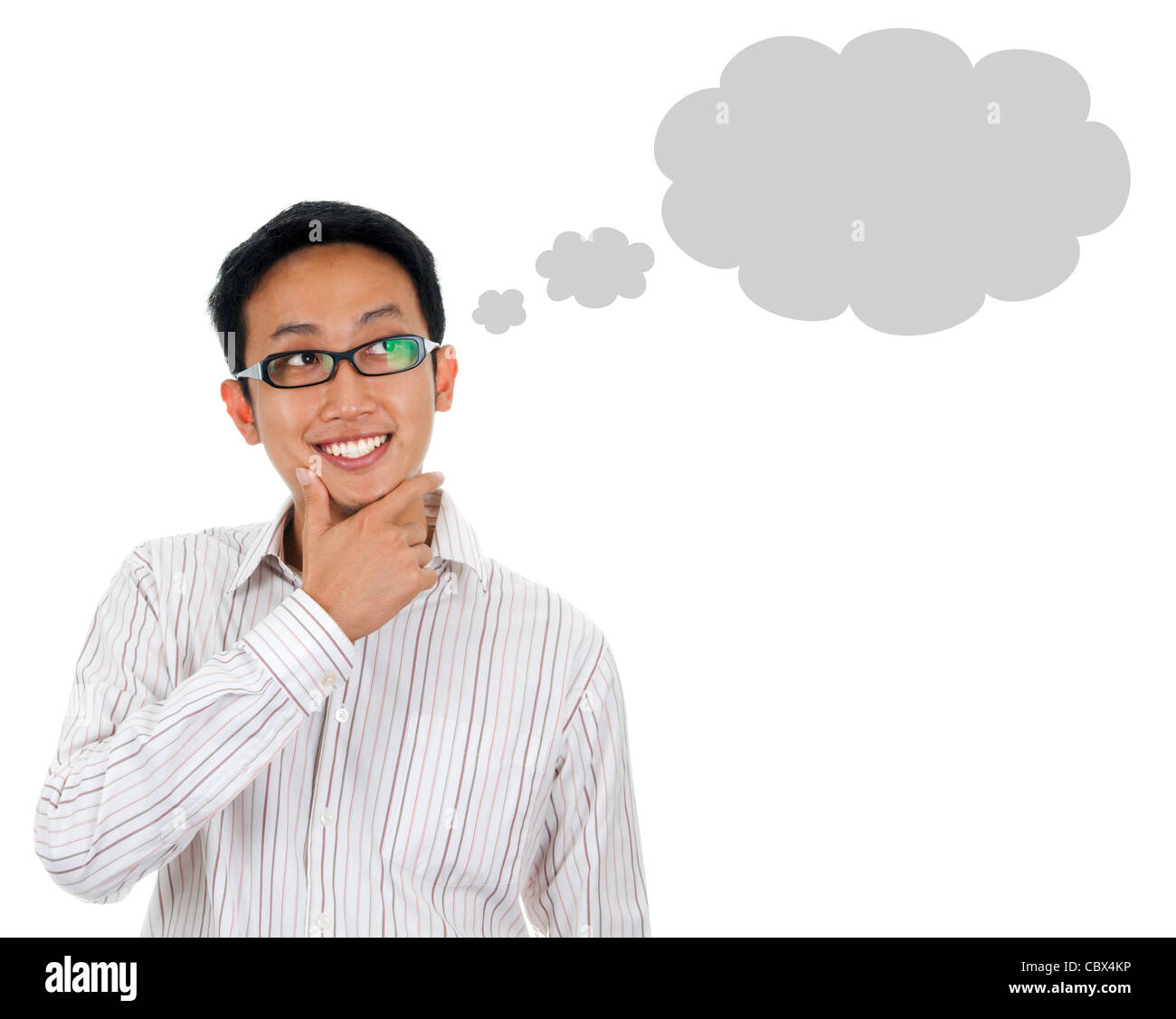 A young Asian man thinking, looking at side Stock Photo - Alamy