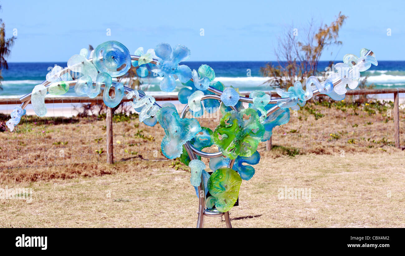 Glass sculpture representing seaweed on display by the ocean at an arts ...