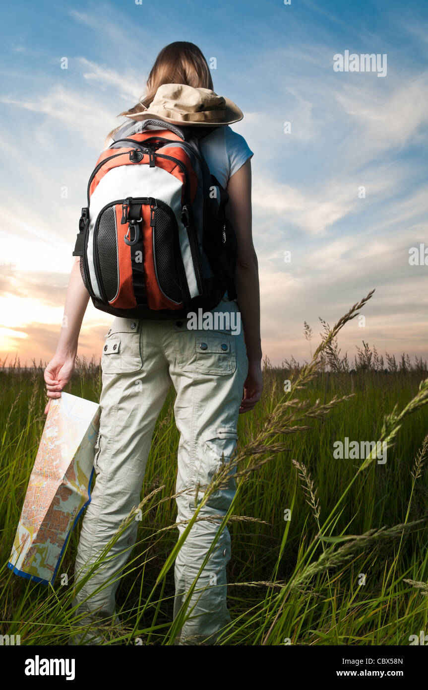 Woman back to camera looking at map hi-res stock photography and images ...
