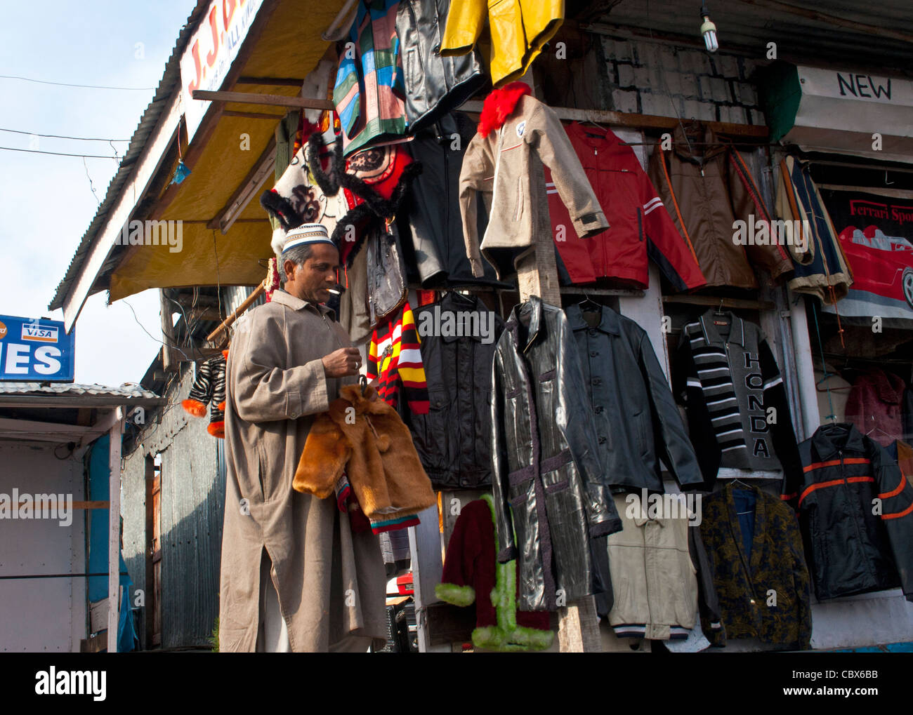 Shop keeper in a cloth store in Dal lake, Kashmir Stock Photo - Alamy
