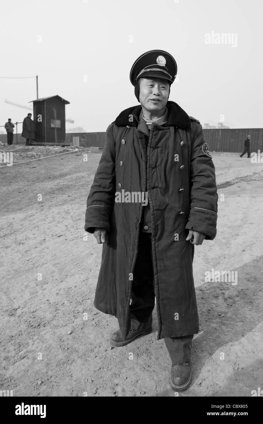 Dongbaxiang, Beijing. Security guard at a construction site Stock Photo ...