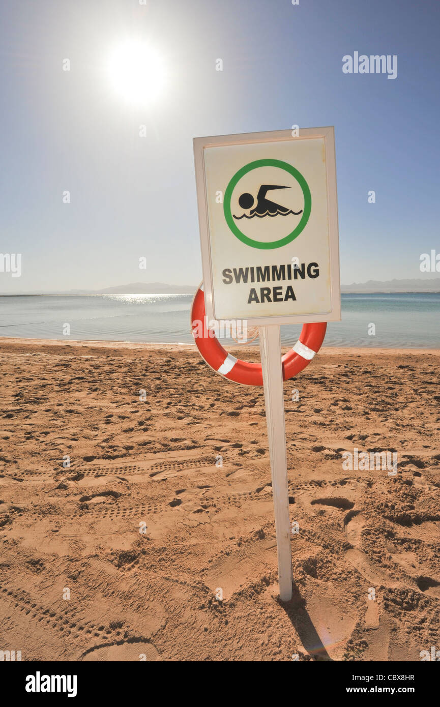 Sign indicating swimming on a tropical beach Stock Photo - Alamy