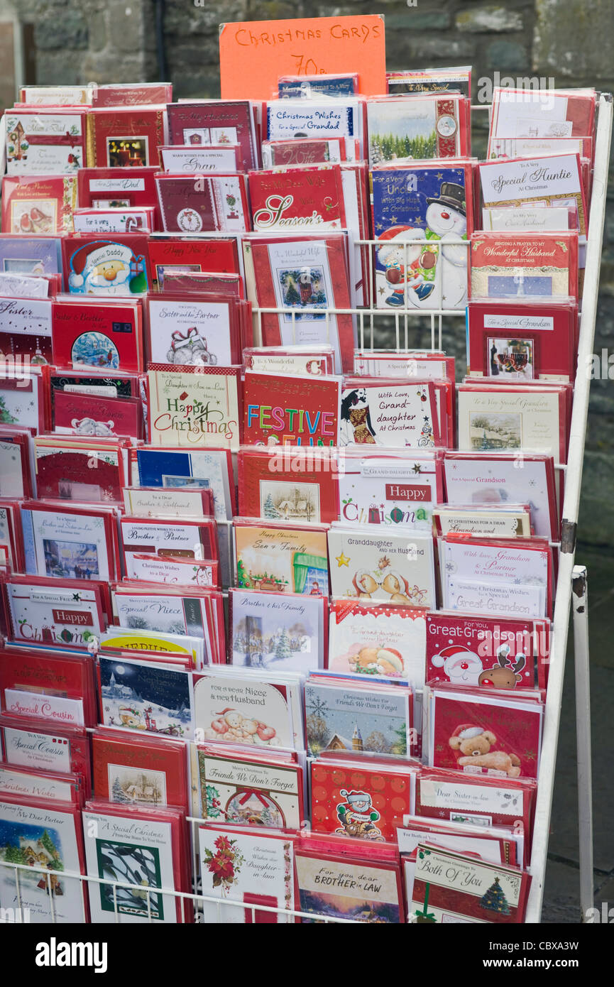 Xmas Christmas cards on rack for sale at weekly street market in Hay-on ...