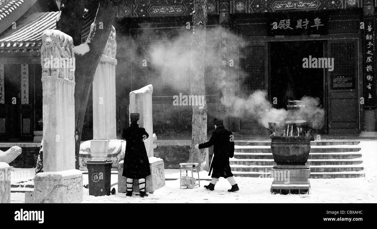 Taoist monks burning incense during the Chinese New Year celebrations ...