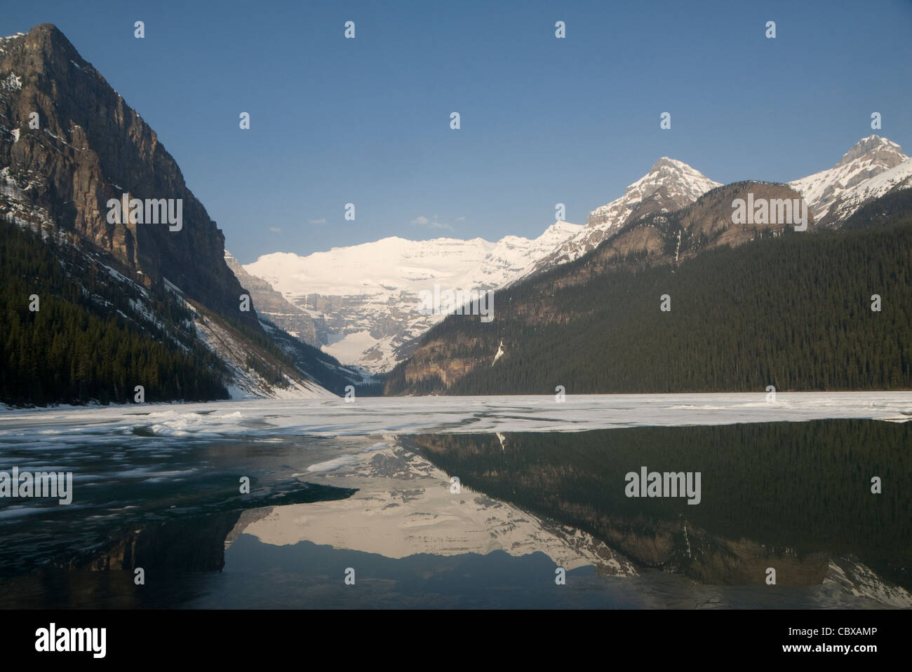 Frozen lake and mountains, Lake Louise, Banff, Alberta, Canada Stock ...