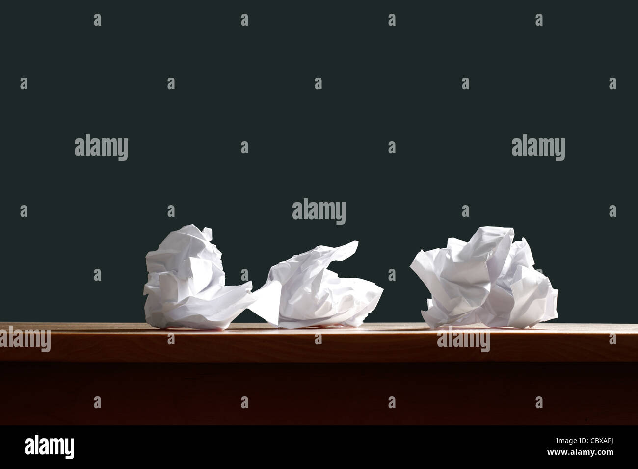 Crumpled paper on desk Stock Photo - Alamy