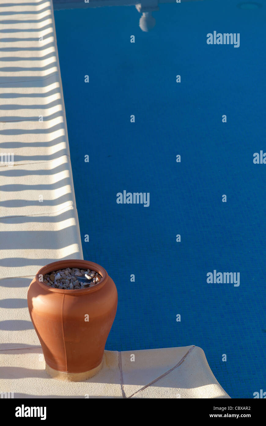 Detail take of a swimming pool with the reflection of its balustrade ...