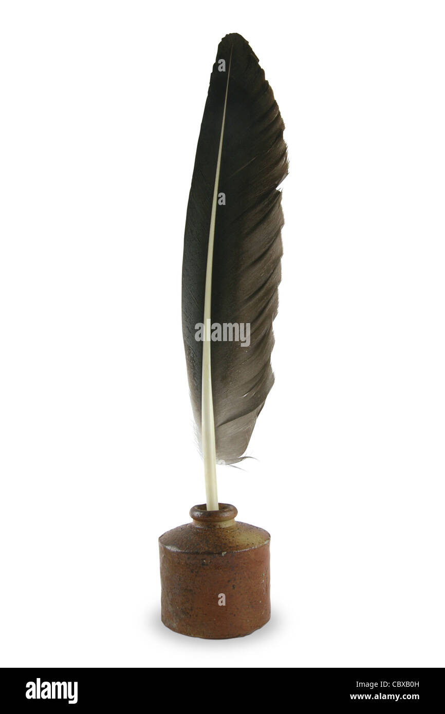 Feather quill pen in a circa 1830s to 1880s stoneware button inkwell ...