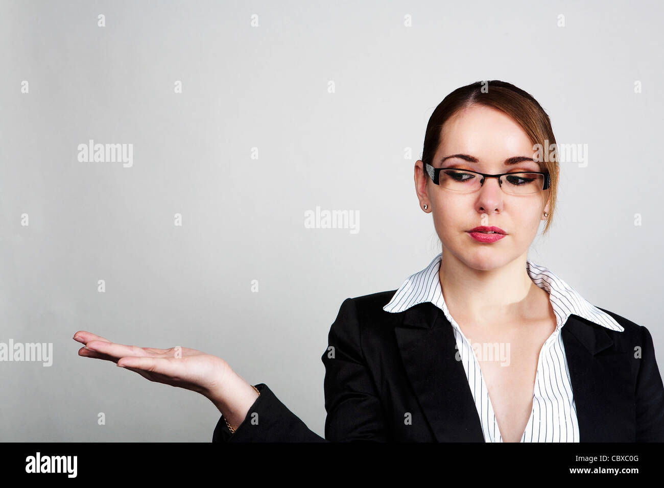 woman holding out her hand and looking down at whatever you want to put ...