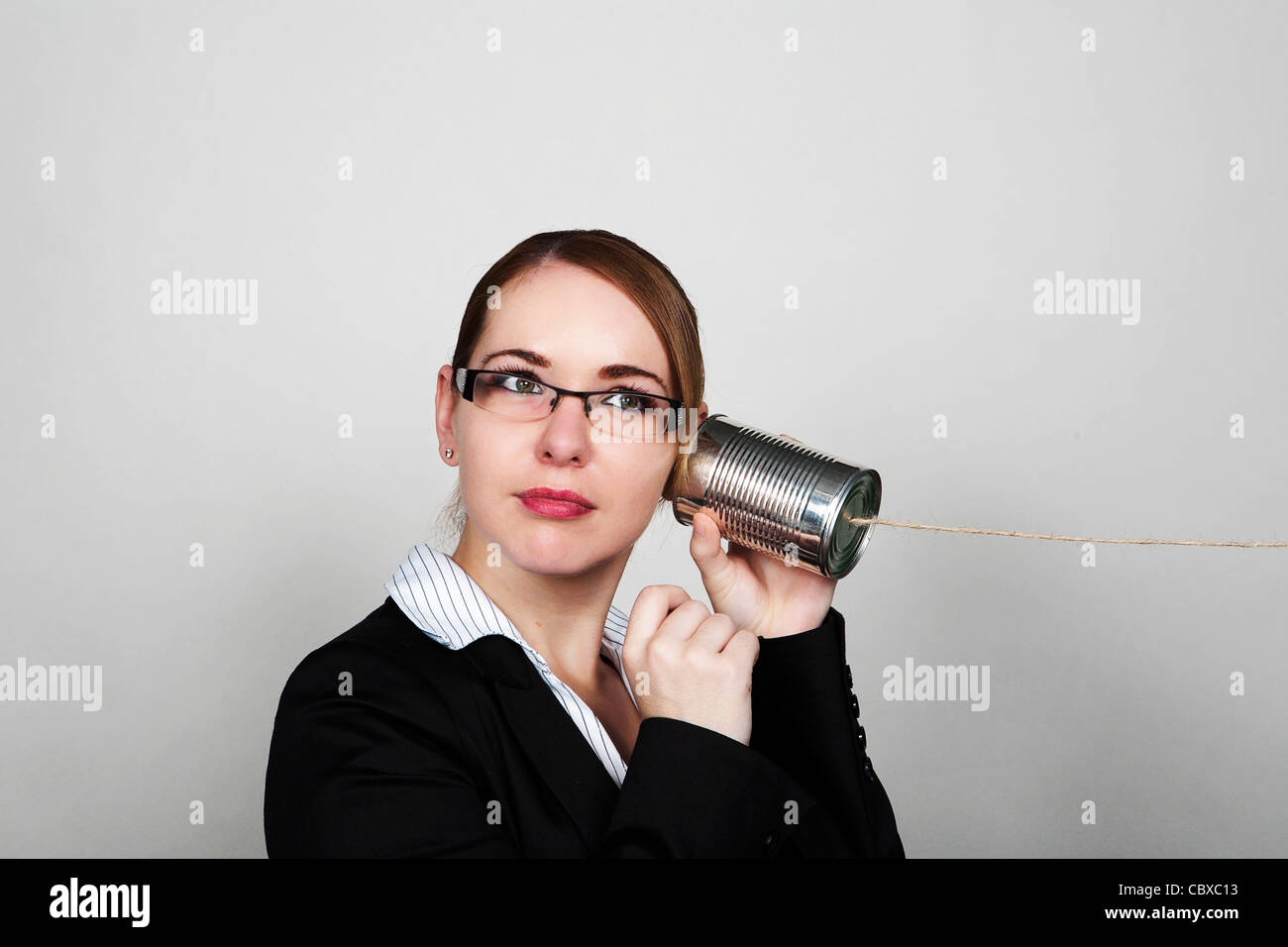 On a string and can phone hi-res stock photography and images - Alamy