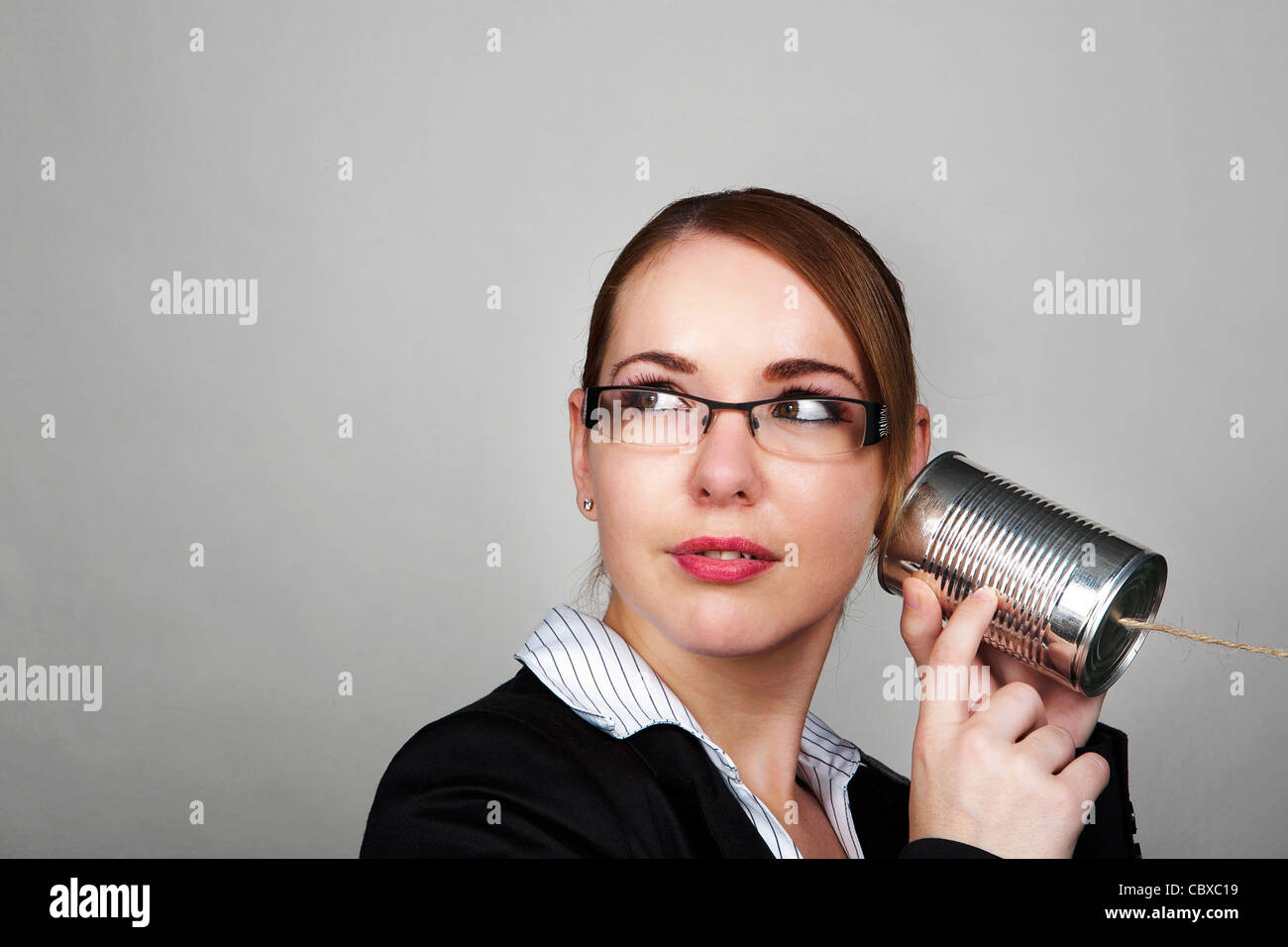 On a string and can phone hi-res stock photography and images - Alamy