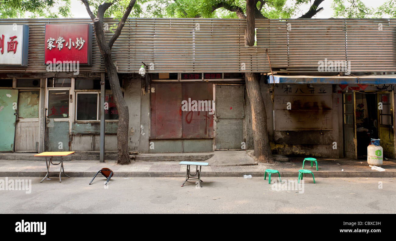 Tianshuiyuan, Beijing. Street scene with makeshift shops in a poor area ...