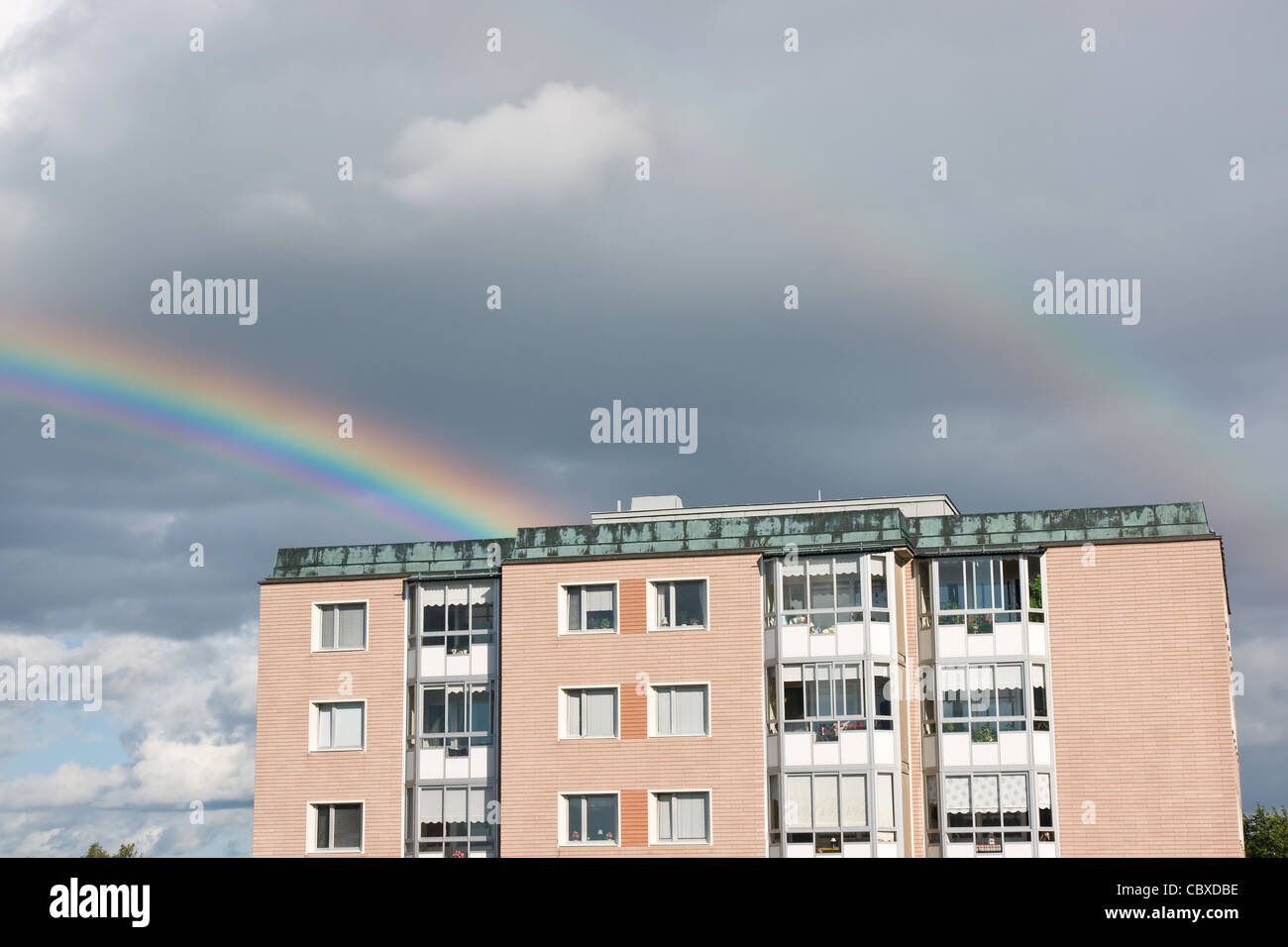 Rainbow over building Stock Photo - Alamy
