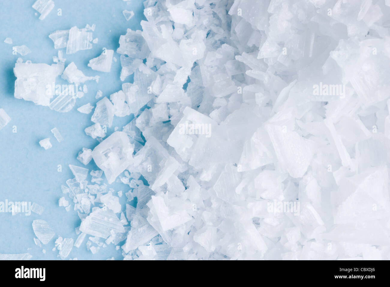Ocean salt isolated on blue Stock Photo - Alamy