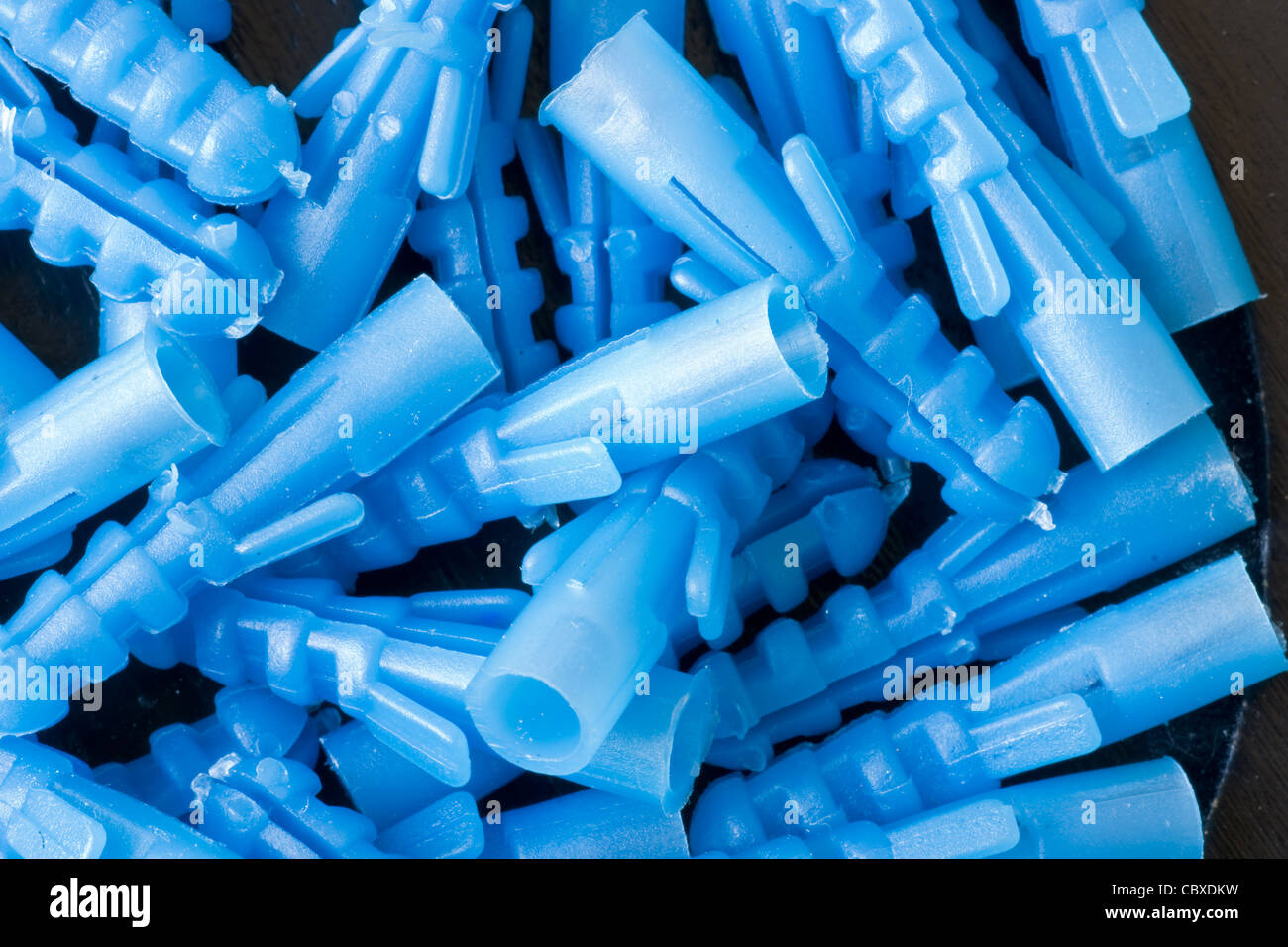 Blue wall plugs isolated Stock Photo - Alamy
