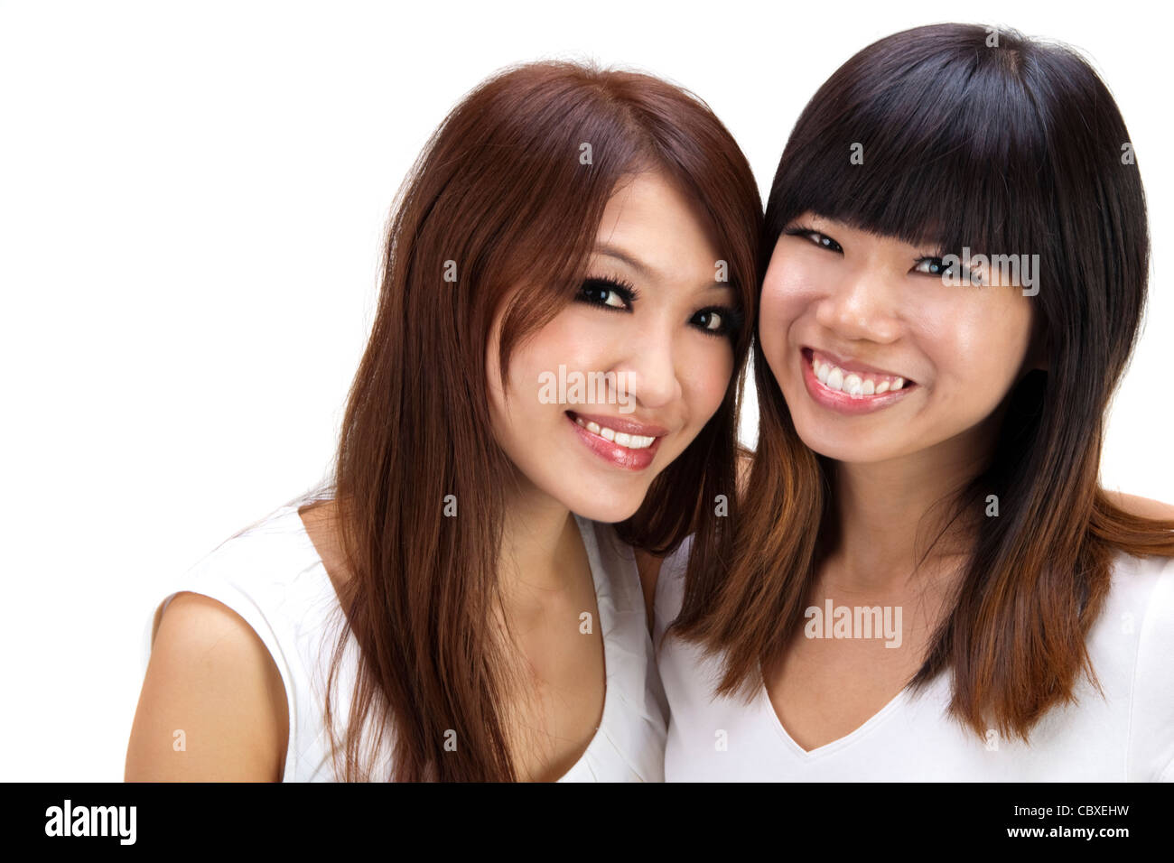Two Asian best friend smiling on white background Stock Photo - Alamy