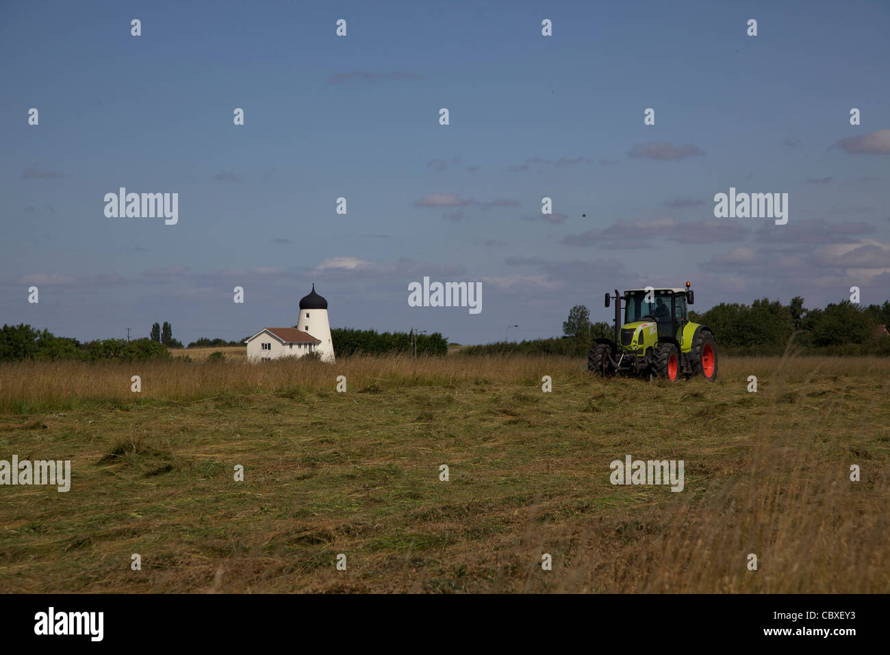 Tractor and Windmill Stock Photo - Alamy