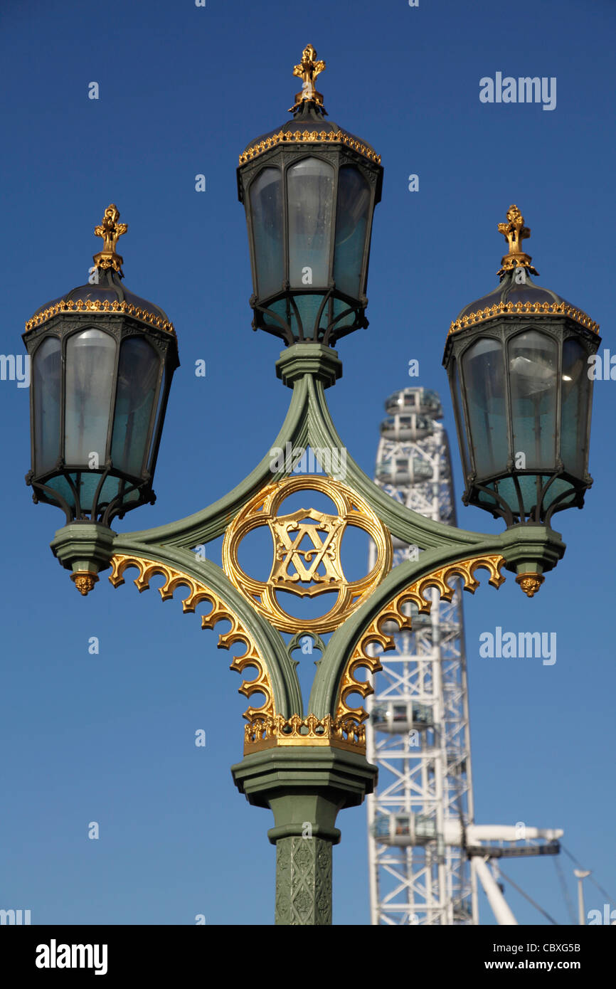 TRADITIONAL LAMP POST WITH THE LONDON EYE IN BACKGROUND BY THAMES RIVER ...