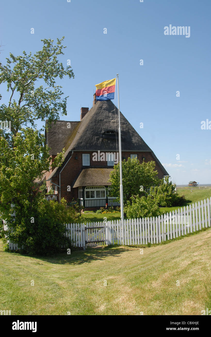 Kirchwarft (church mound) at the North Frisian island of Hallig Hooge ...