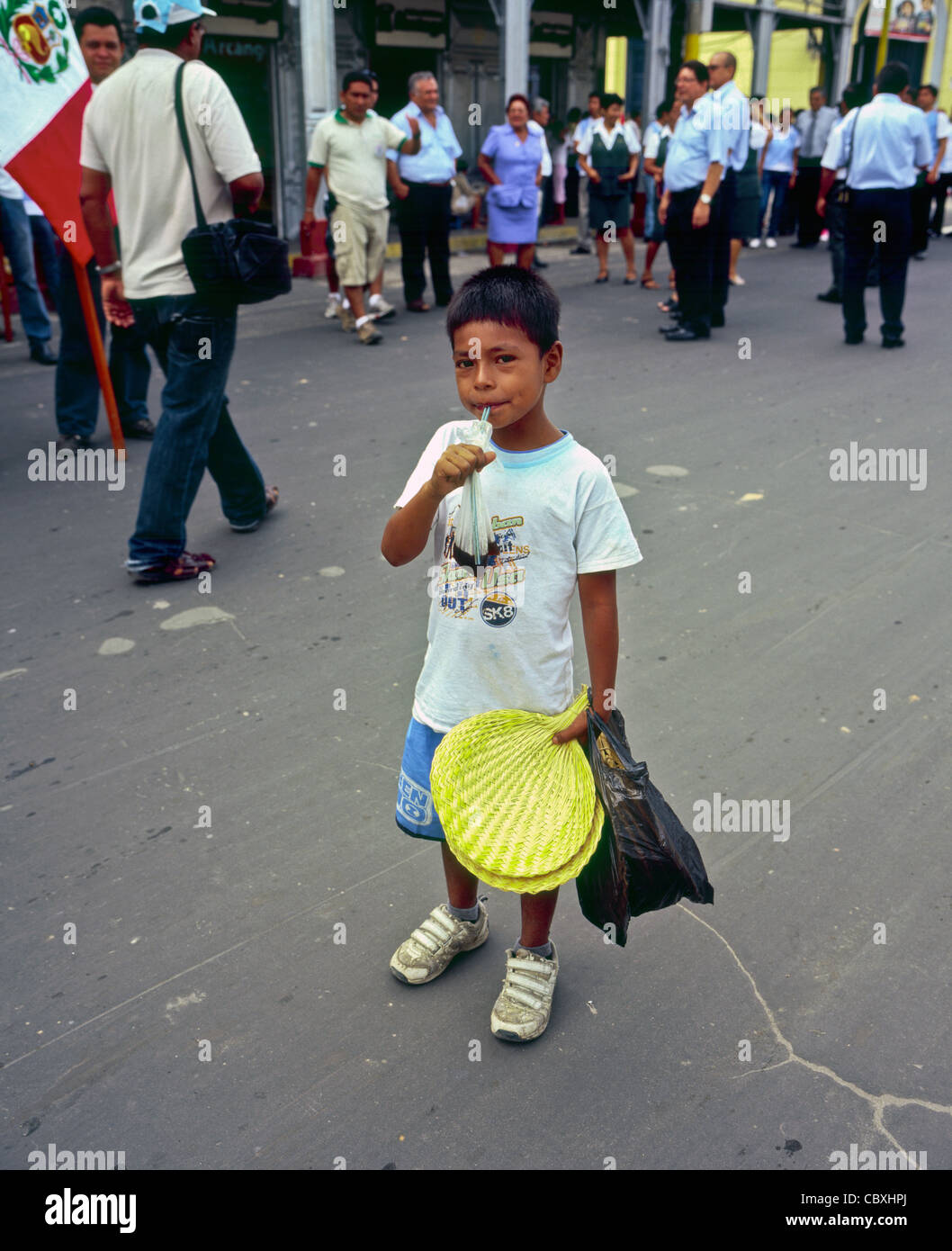 A young boy street selling in Iquitos Peru Stock Photo - Alamy