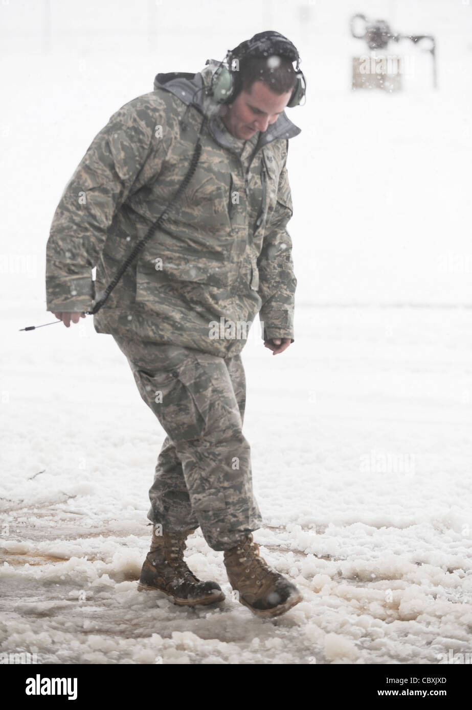 Staff Sgt. Thomas Beall watches his step as he works on the flightline ...