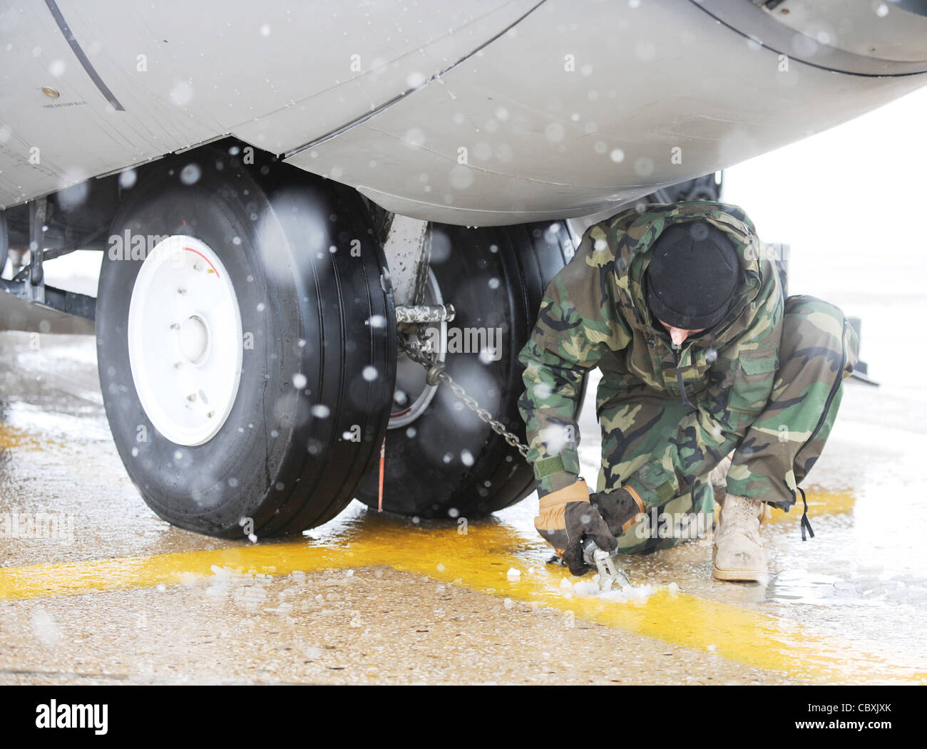 An Airman with the 106th Aircraft Maintenance Squadron works to secure ...