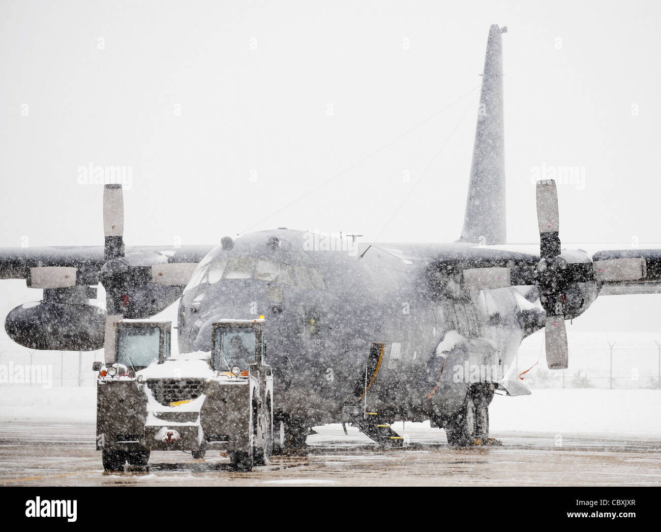 Airmen with the 106th Aircraft Maintenance Squadron work to secure a HC ...