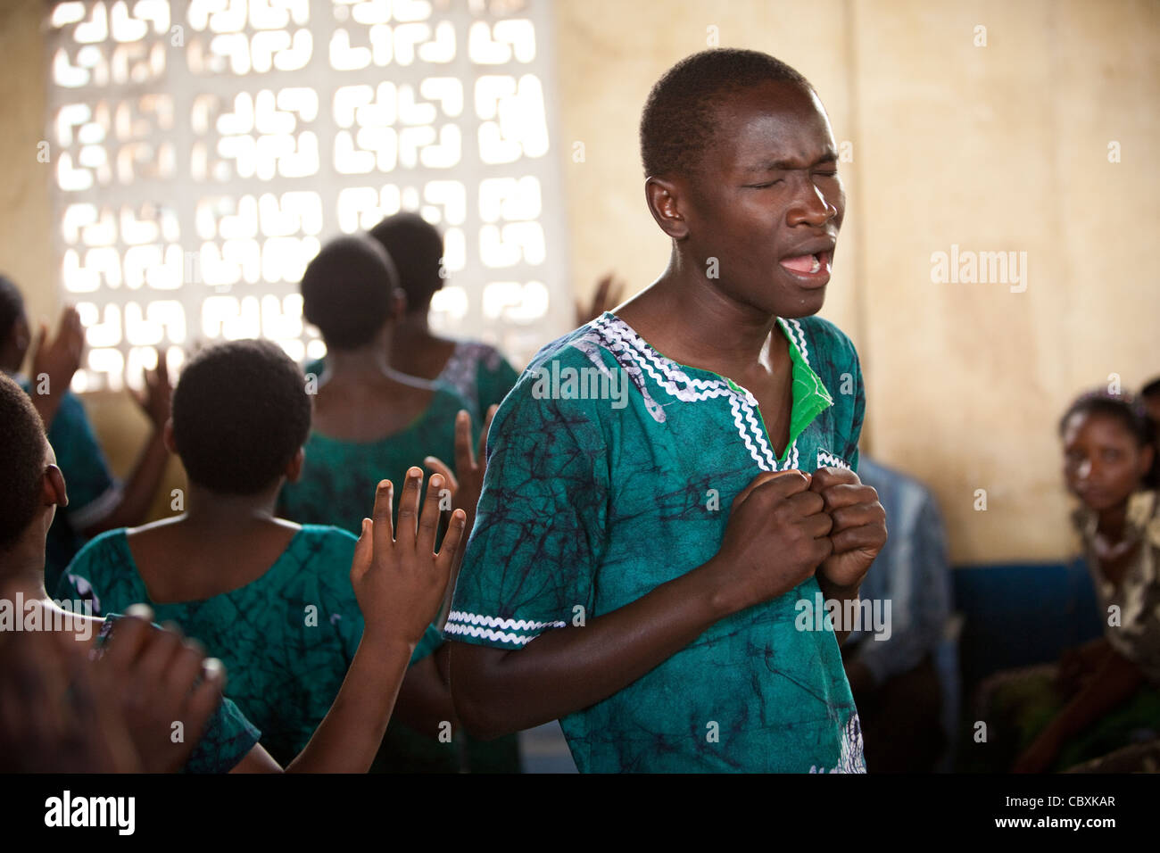 A youth choir sings and dances at a church in Morogoro, Tanzania, East ...