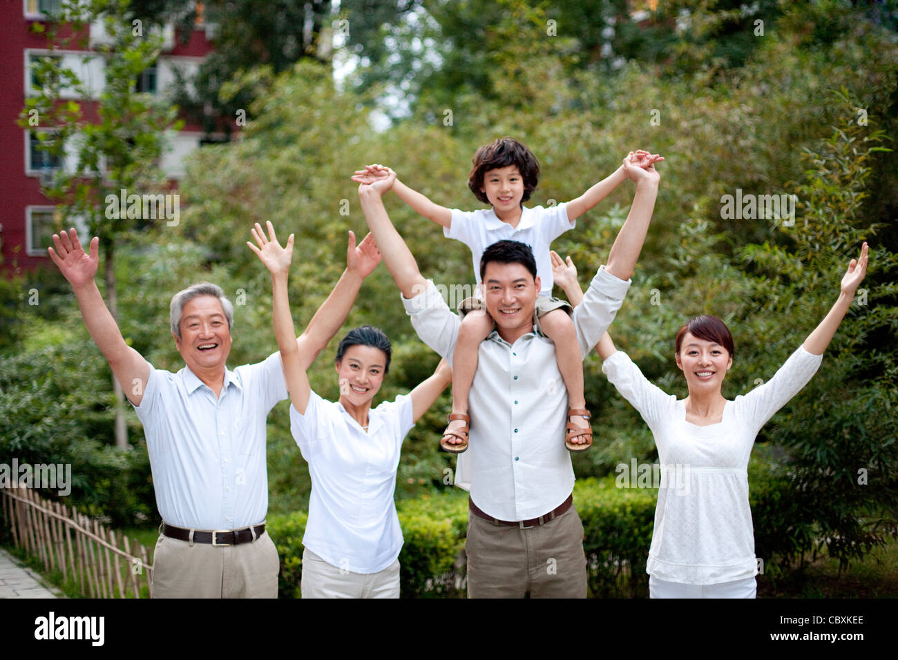 Happy family in a common community Stock Photo - Alamy