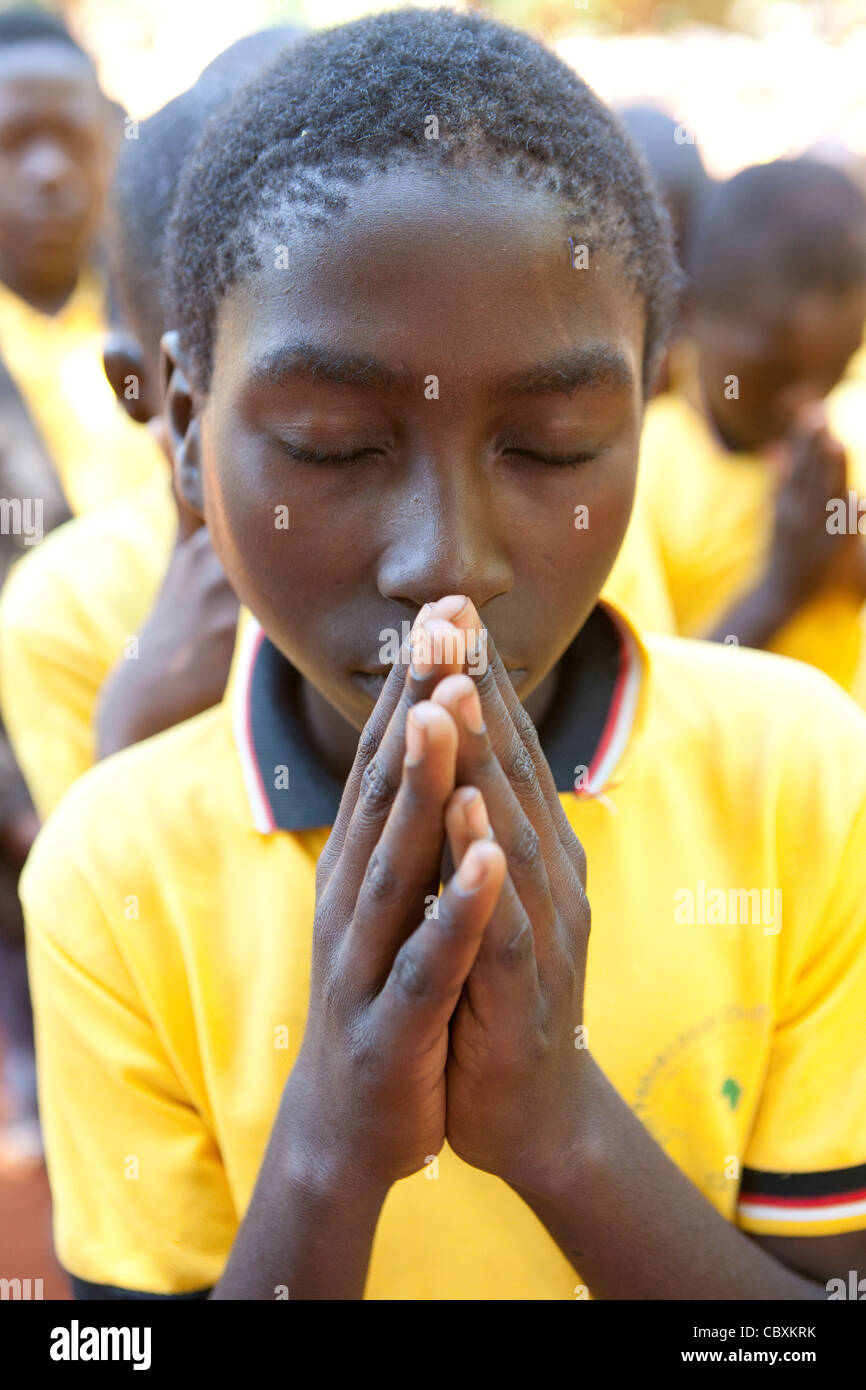 Students pray during school assembly in Morogoro, Tanzania, East Africa ...