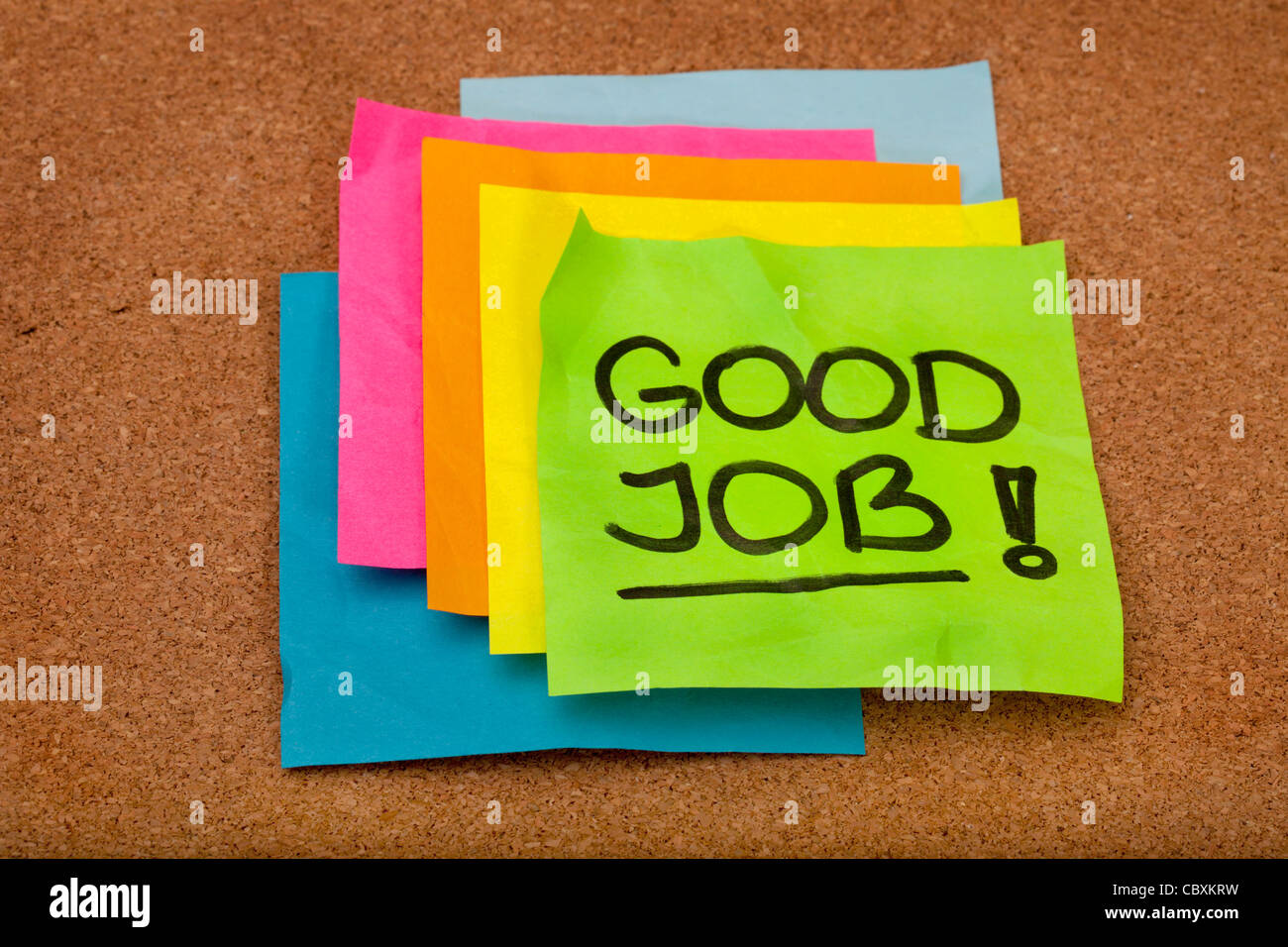 good job - congratulation, a stack of colorful sticky notes on cork ...