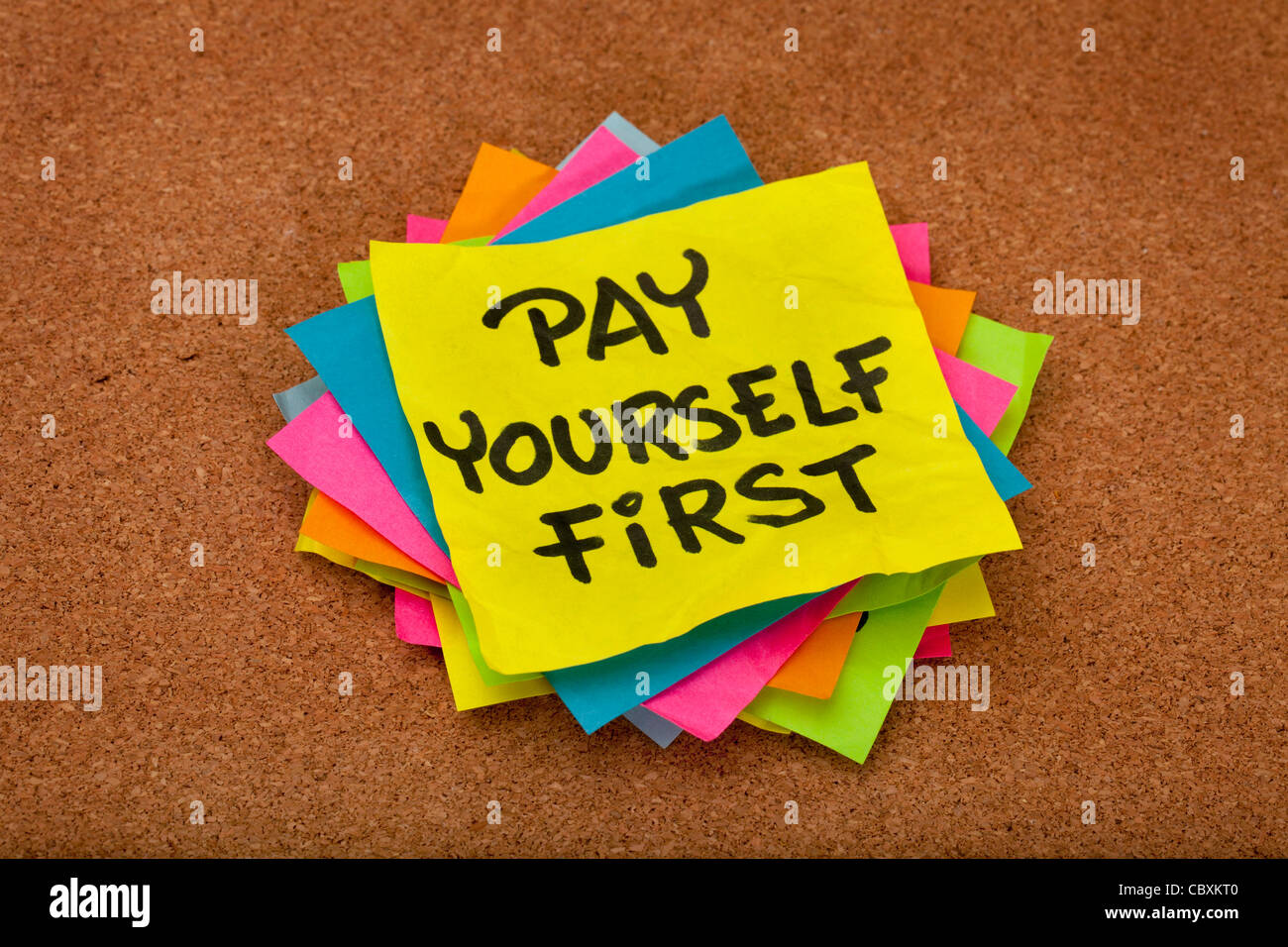 pay yourself first, a reminder of personal finance strategy - stack of ...