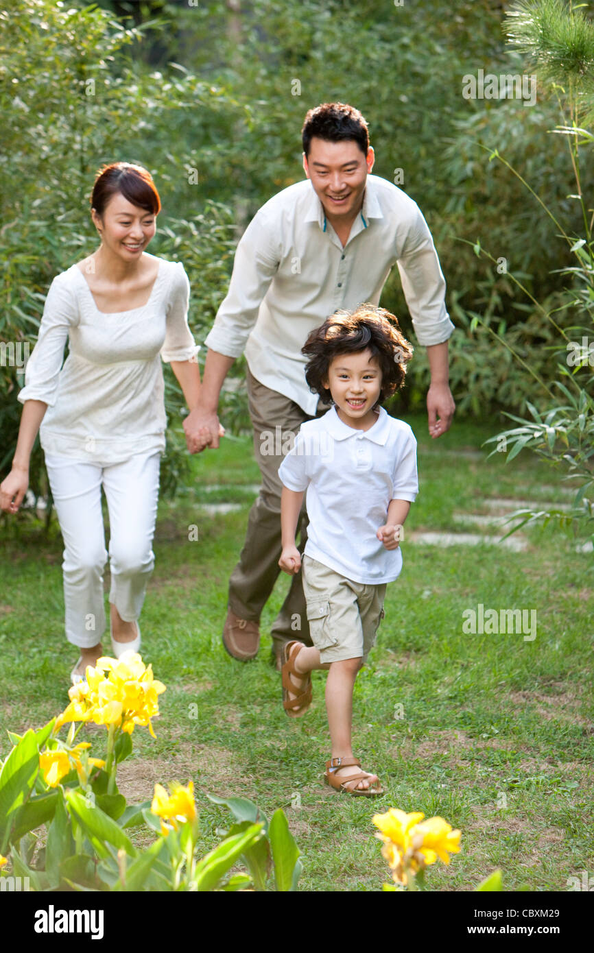 Family having fun in garden Stock Photo - Alamy